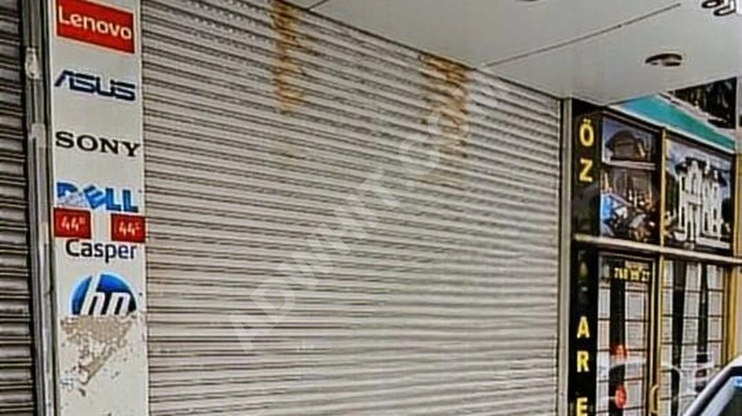 A two-story store on Haznedar Posta Street with automatic sliding doors ...